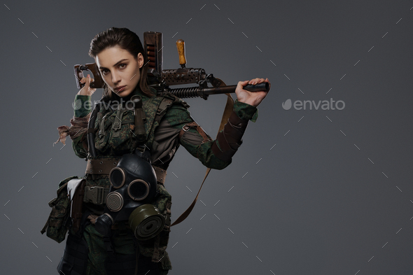 Portrait of a female soldier holding a homemade automatic rifle Stock ...
