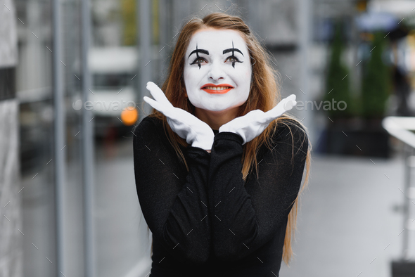 The girl with makeup of the mime. improvisation. mime shows different ...