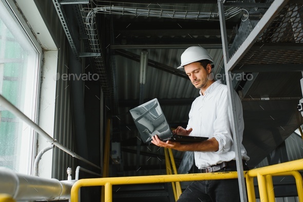 Factory manager in inspection of manufacturing. Man in Industrial ...