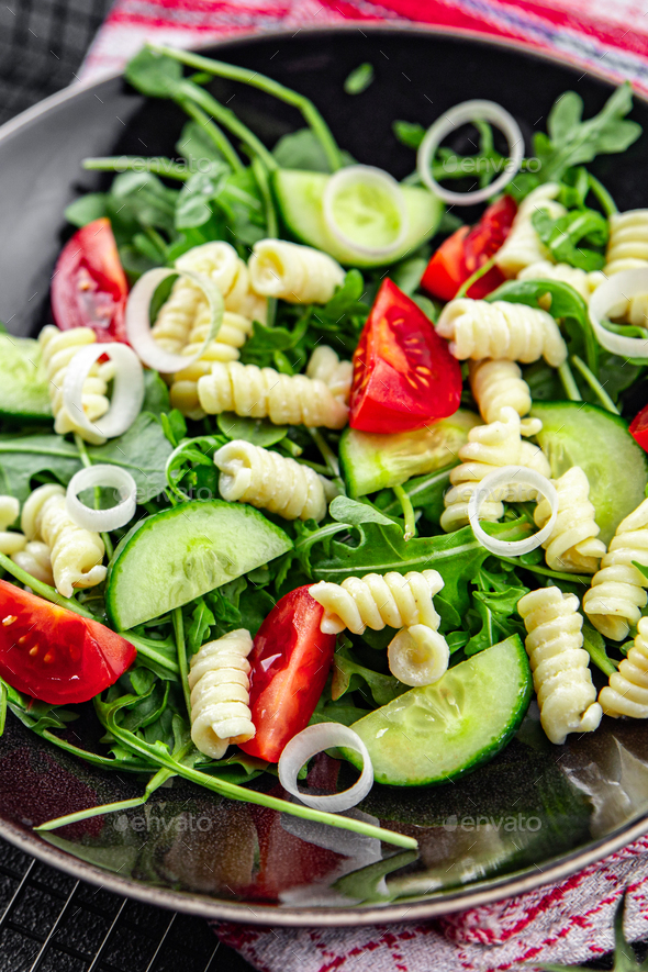 pasta salad fusilli pasta, cucumber, tomato, green lettuce, onion ...