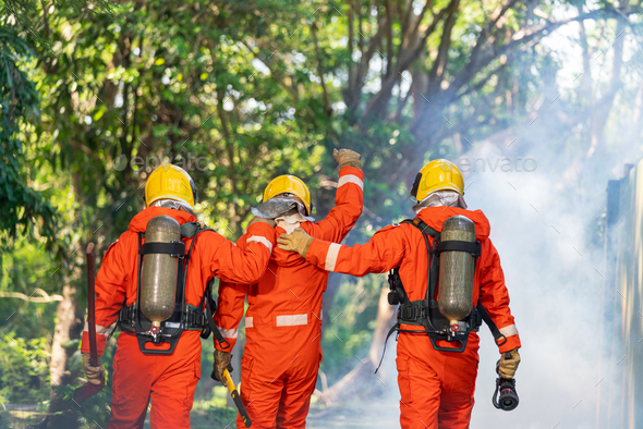 Firefighter in Full Protective Gear. Fireman Combats Intense Blaze with ...