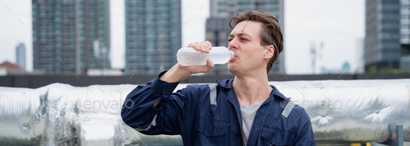 An engineer is now taking a break and drinking water. Stock Photo by ...