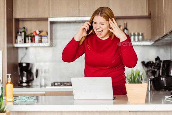 Upset attractive body positive woman talking on mobile phone, shouting ...