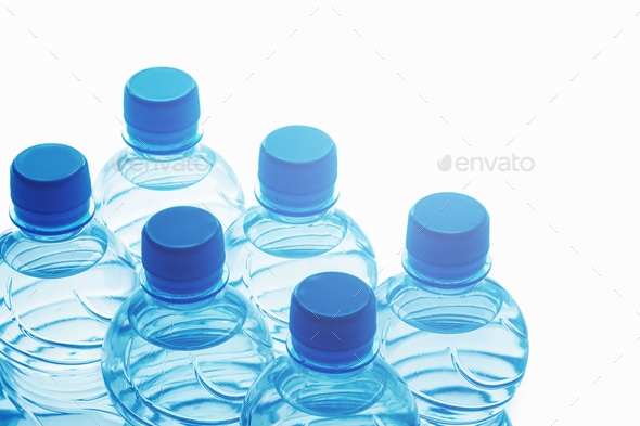 Blue bottles of pure still water against white background Stock Photo ...