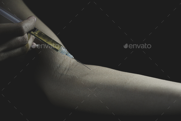 Giving an injection in arm Stock Photo by Wdnld | PhotoDune