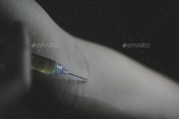 Giving an injection in arm Stock Photo by Wdnld | PhotoDune