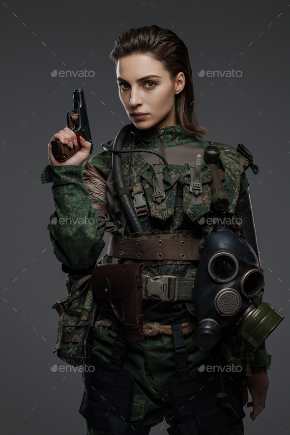 Female warrior dressed in military garb, armed with a pistol Stock ...