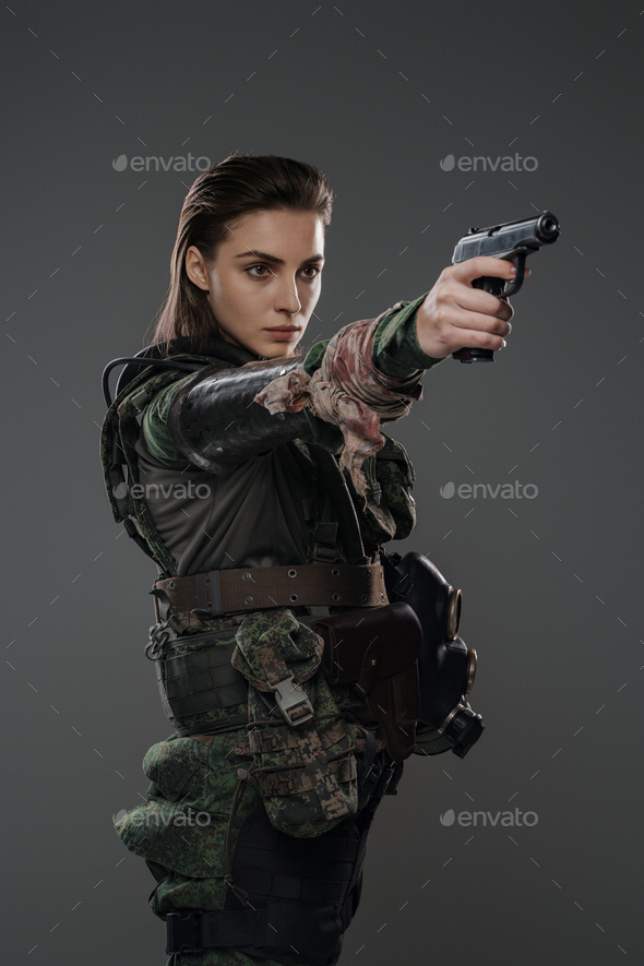 Female warrior dressed in military garb, armed with a pistol Stock ...