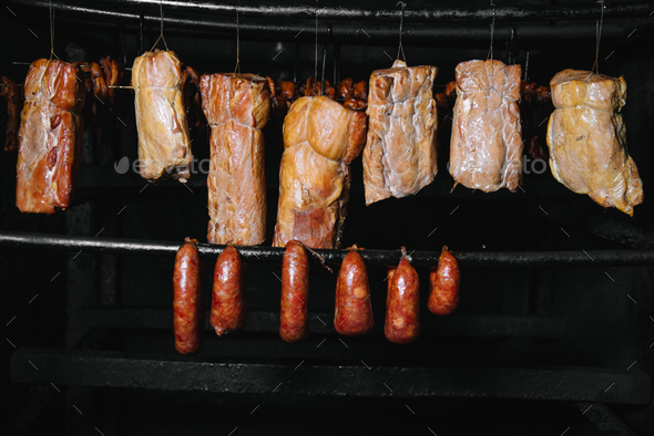 Smoked traditional smoked meat. A composition of smoked cold cuts on a ...