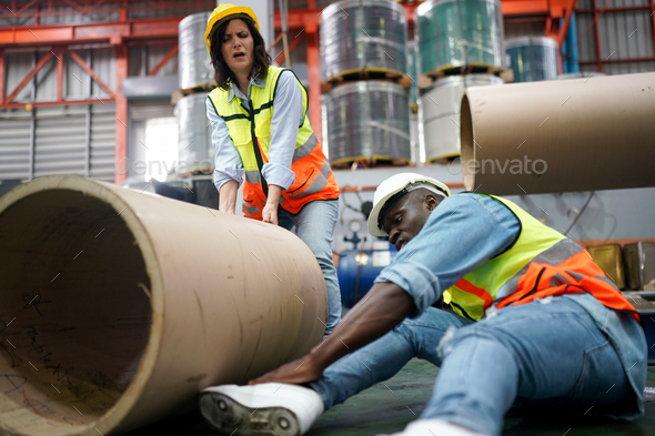 Accident scene in warehouse factory with two foreman and someone has ...