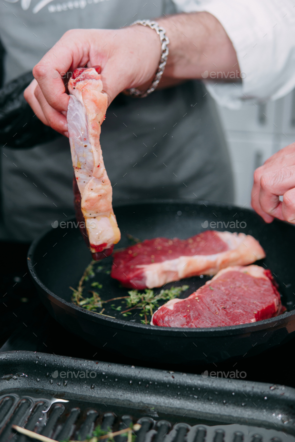 cooking steaks in a pan. cooking beef at the culinary master class ...