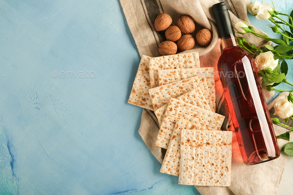 Passover celebration concept. Matzah, red kosher walnut and spring ...