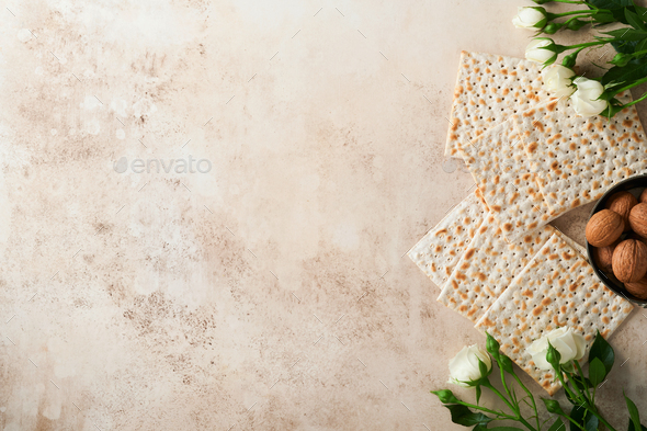 Passover celebration concept. Matzah, red kosher walnut and spring ...