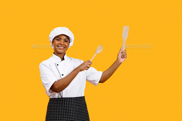 Happy Young Black Chef Lady Pointing At Copy Space With Wooden Spatulas ...