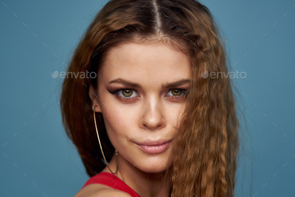 Attractive woman wavy hair charming look cosmetics elegant style blue ...