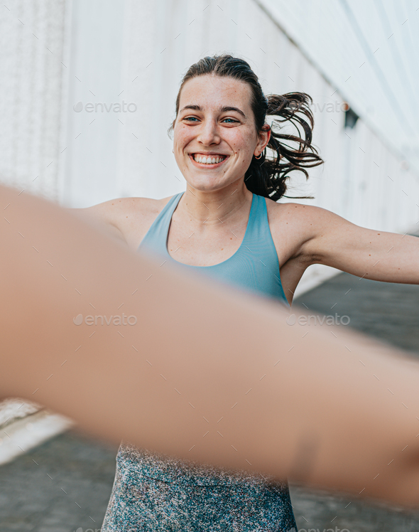 Young woman trainer teaching the different exercises to a student while ...