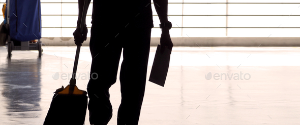 Silhoutte images of cleaning service man staff working on building ...