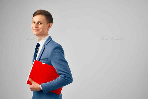 business man in a suit red folder in hands documents work professional ...