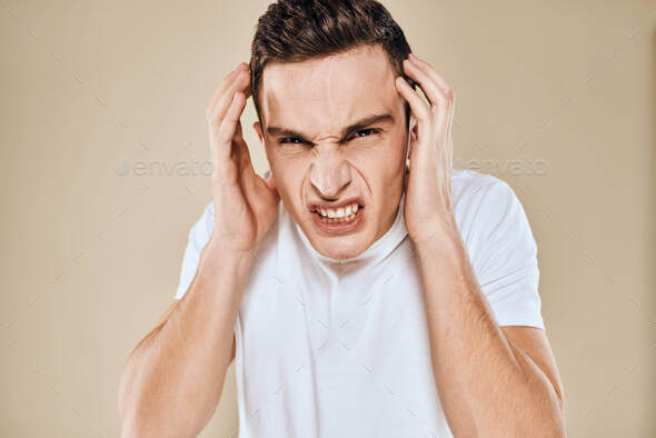 Man with displeased facial expression emotions white t-shirt gestures ...