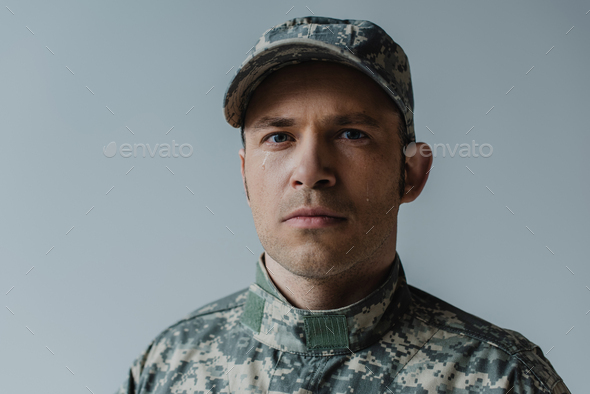 upset soldier in military uniform crying during memorial day isolated ...