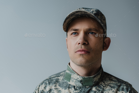 sad military man in uniform crying during memorial day isolated on grey ...