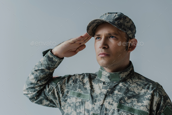 sad military man crying while saluting during memorial day isolated on ...