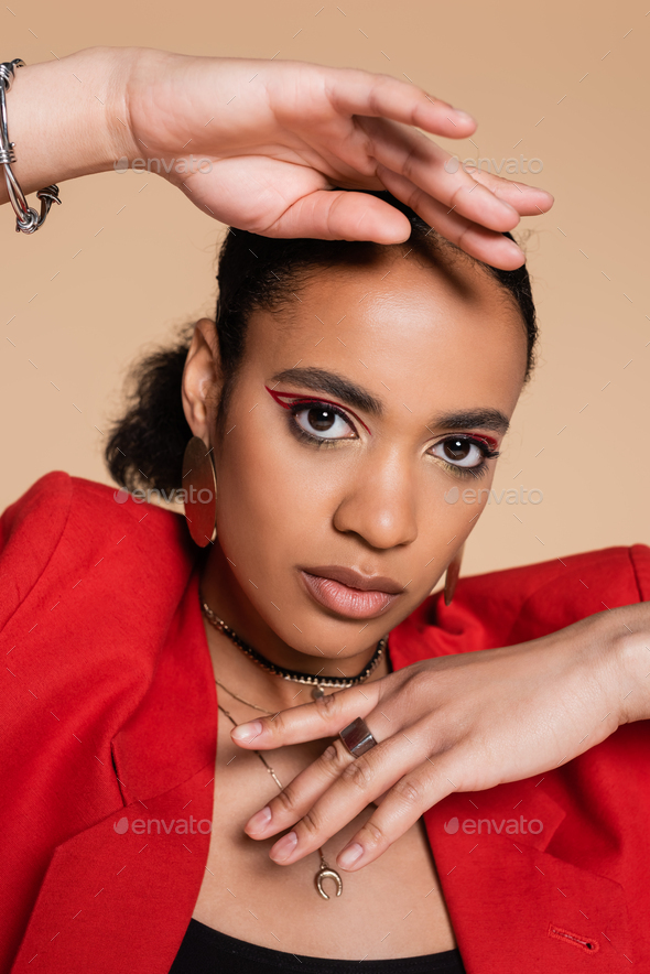 portrait of stylish african american model in bright red blazer ...