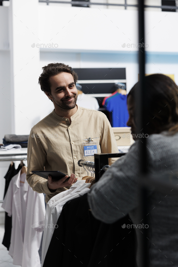 Shopping mall employee assisting client Stock Photo by DC_Studio ...