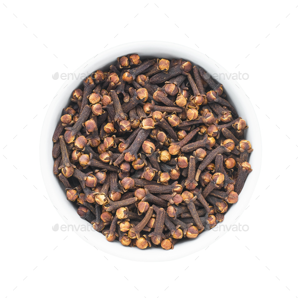 Dried spice cloves in round bowl isolated over white background. Stock ...