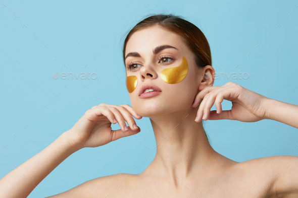 woman patches rejuvenation skin care fun after shower blue background ...