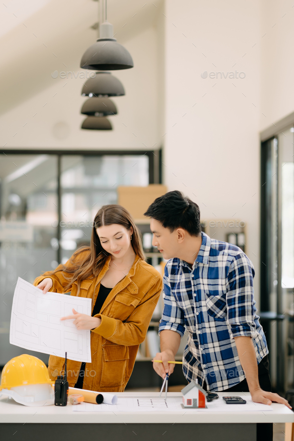 Engineer teams meeting working together wear worker helmets hardhat ...