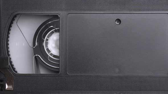 VHS video cassette inserting in the VCR, play, stop, eject, close up ...