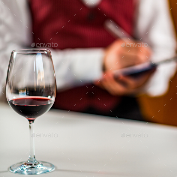 Sommelier examining wine Stock Photo by microgen | PhotoDune