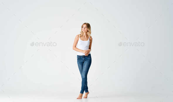 pretty woman in jeans barefoot movement posing emotions model Stock ...
