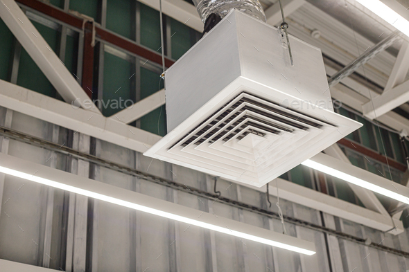 Square grid with supply ventilation duct in commercial building ...