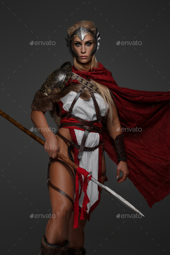 Viking Shieldmaiden: Muscular Warrior in Fantasy Armor with Red Cloak Stock Photo by fxquadro
