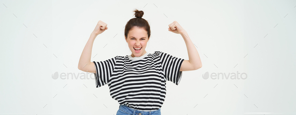 Image of sassy, strong and confident woman shows her muscles, flexing ...
