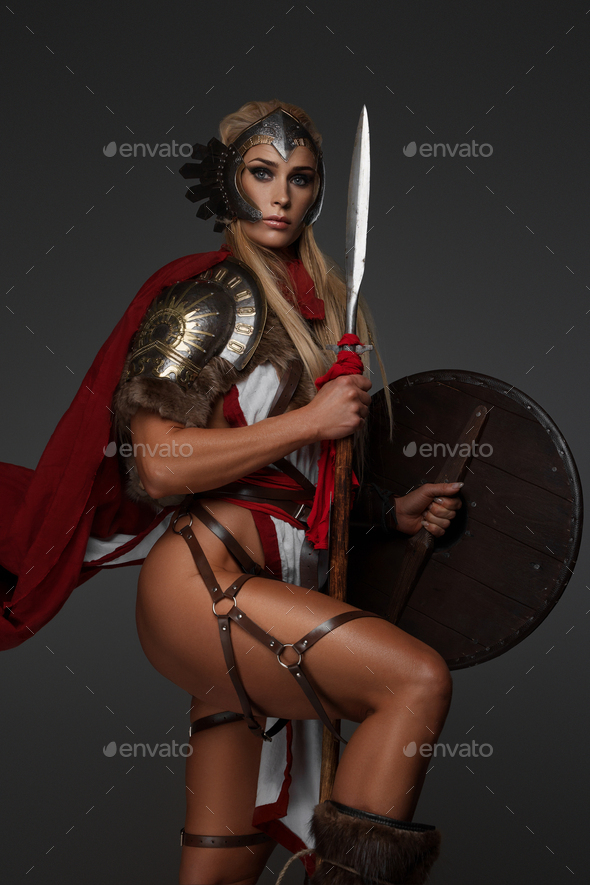 Viking Shieldmaiden: Muscular Warrior in Fantasy Armor with Red Cloak Stock Photo by fxquadro