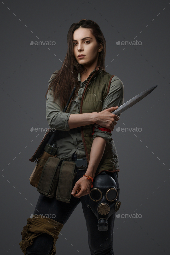 Middle eastern female survivor, dagger pose Stock Photo by fxquadro