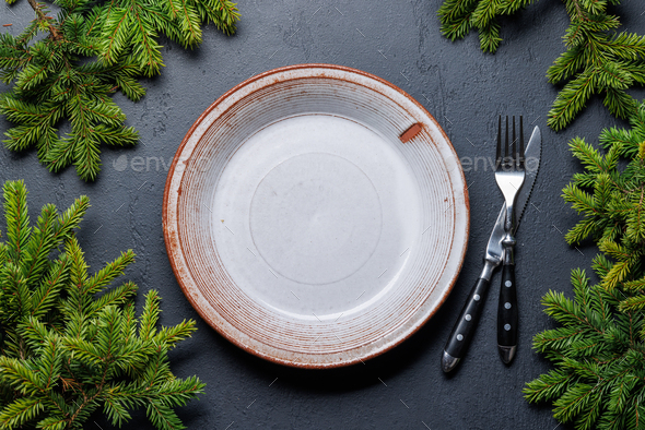 Table setting from above with empty plate Stock Photo by karandaev