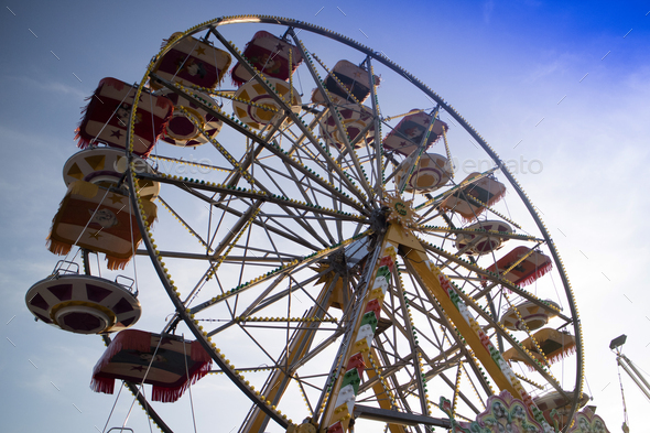 Inside an amusement park the colors of the Ferris wheel Stock Photo by ...