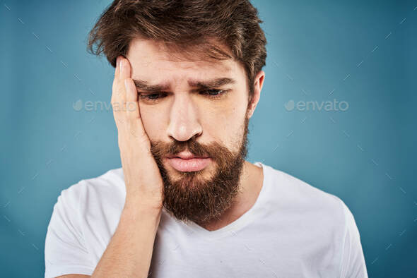 Bearded man displeased facial expression emotions close-up blue ...