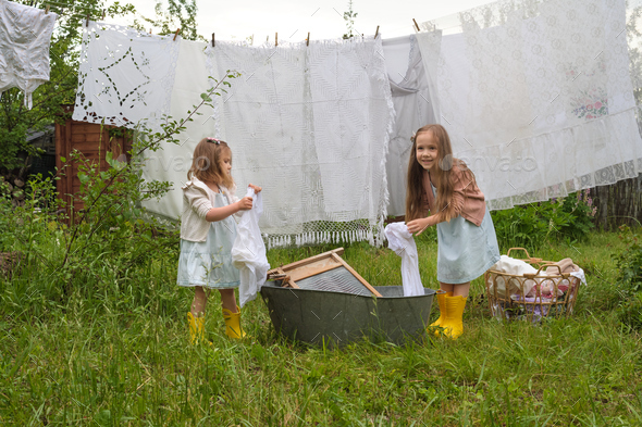 Sustainable upbringing: Kids engaging in eco-friendly outdoor chores, a ...