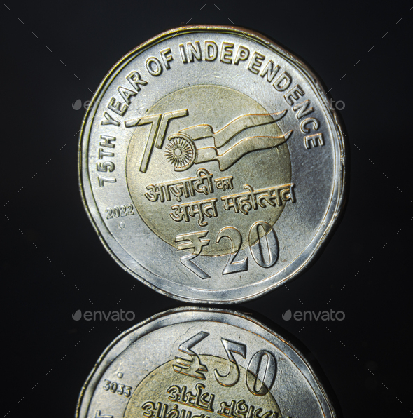 Indian ruppee commemorative coin on a black background Stock Photo by ...