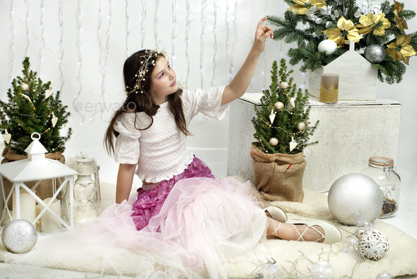 Delicate Christmas background with charming fir trees, light garlands ...