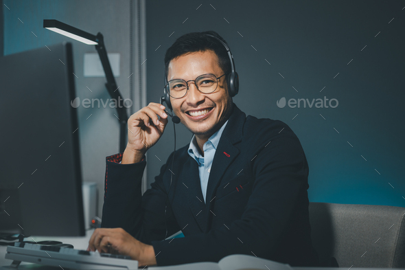 Call center employee talking with customer through headset, The ...