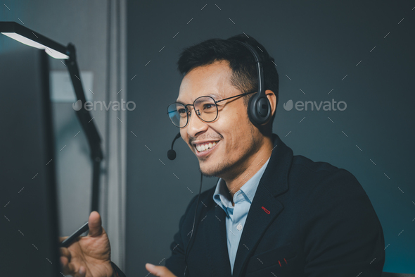 Call center employee talking with customer through headset, The ...