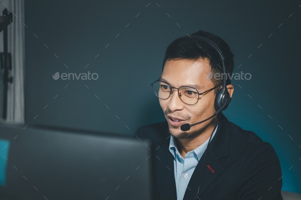 Call center employee talking with customer through headset, The ...