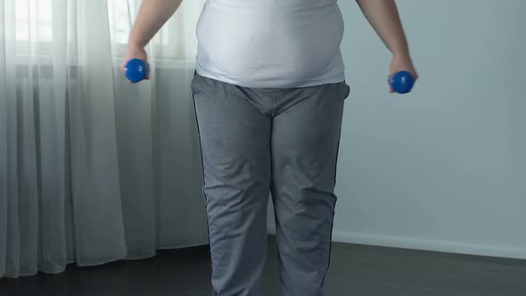 Motivated Fat Man Exercising Squats and Lifting Dumbbells Strengthening ...