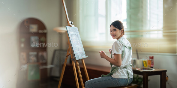 Talented Female Artist Working on a artist lifestyle. painting hobby ...